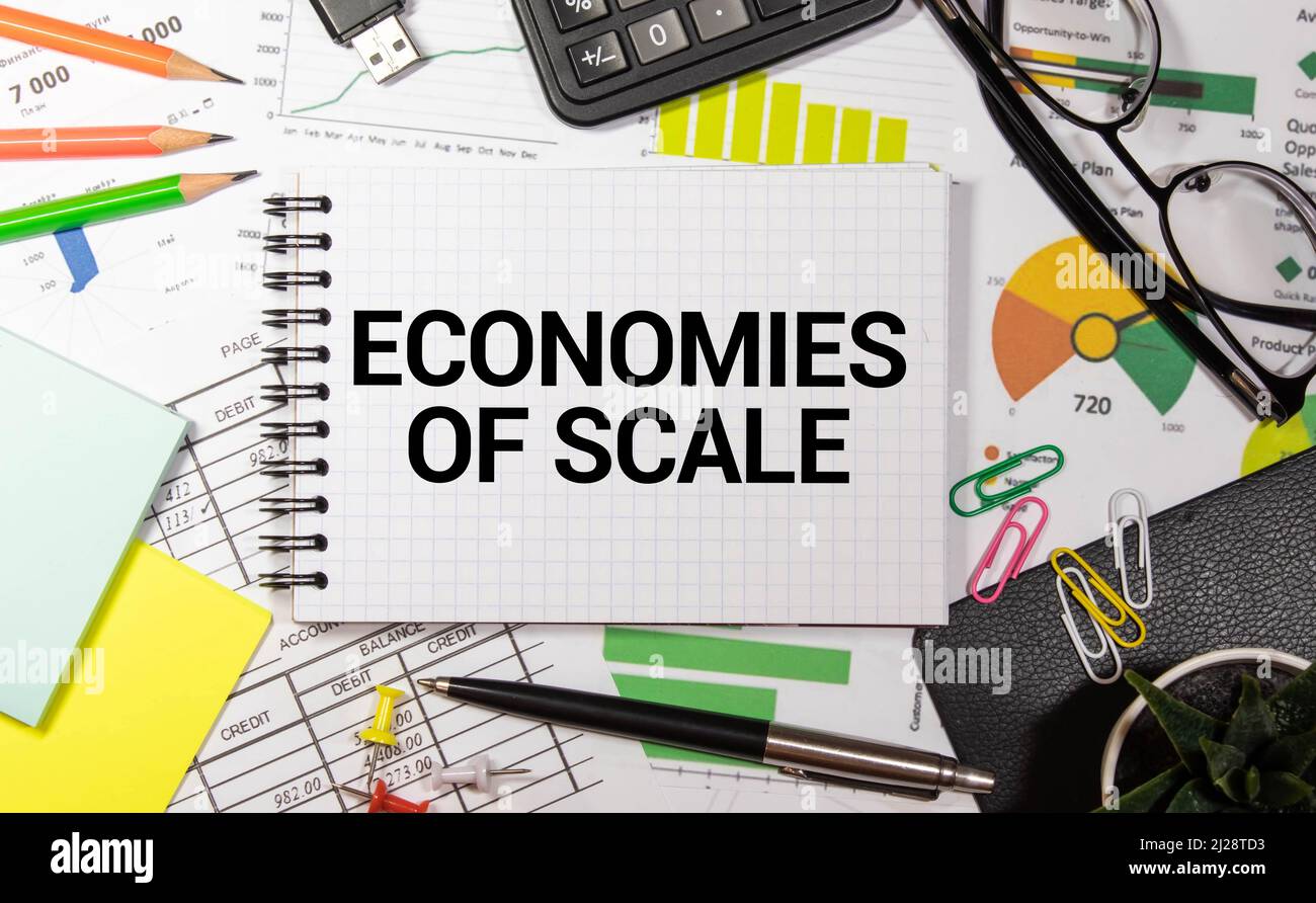 Business and economy concept. On a red background, wooden blocks with ...