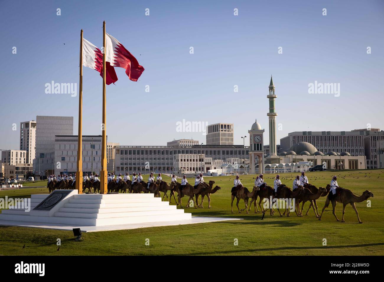 Doha, Qatar. 30th Mar, 2022. Riders on their camels are on the lawn in ...