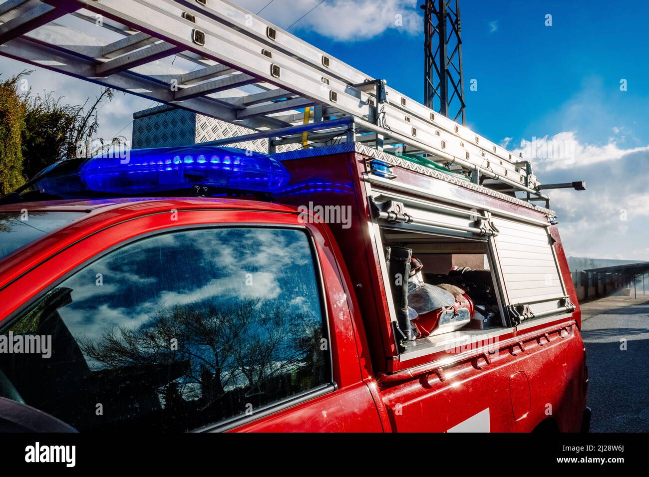 A fire truck with its tools to extinguish a daytime fire Stock Photo ...