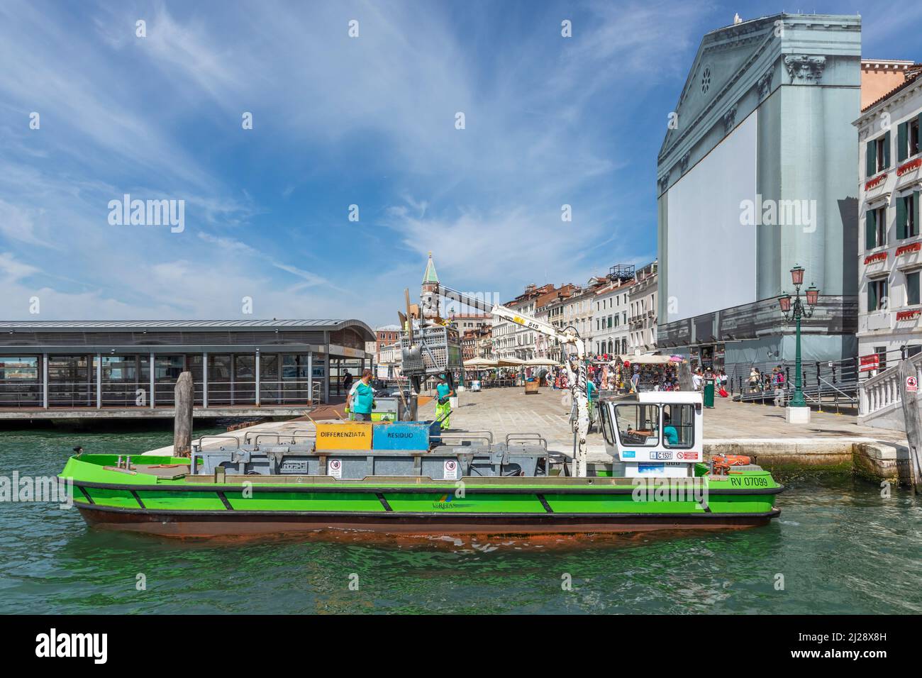 Venice, Italy - July 5, 2021: garbage men collect the garbage from the ...