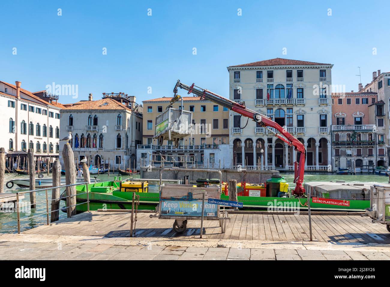 Venice, Italy - July 7, 2021: garbage men collect the garbage from the ...