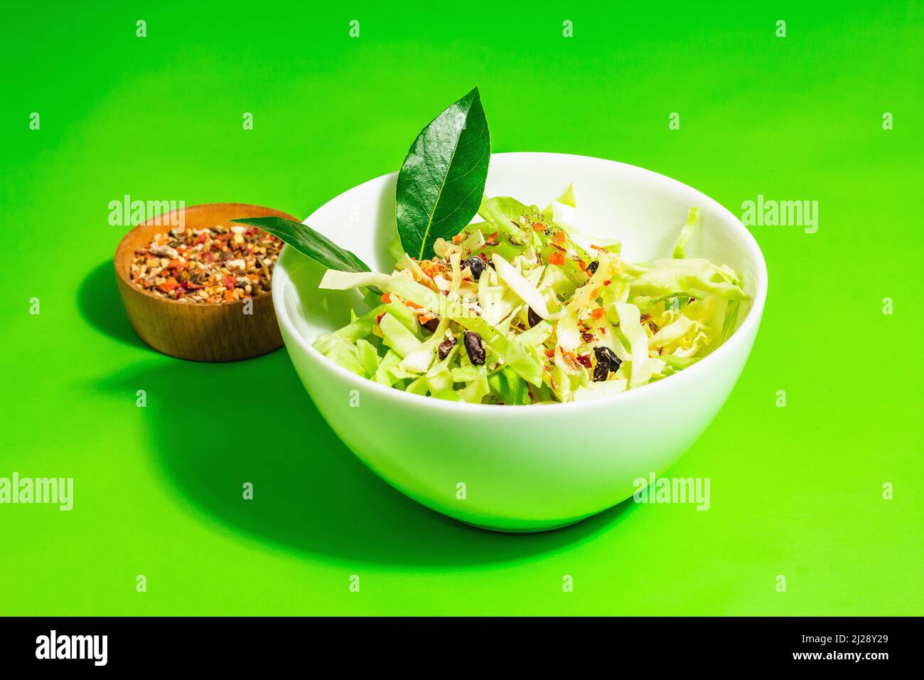 Spring diet salad. Fresh vegan vitamin food. Sliced cabbage, spices ...