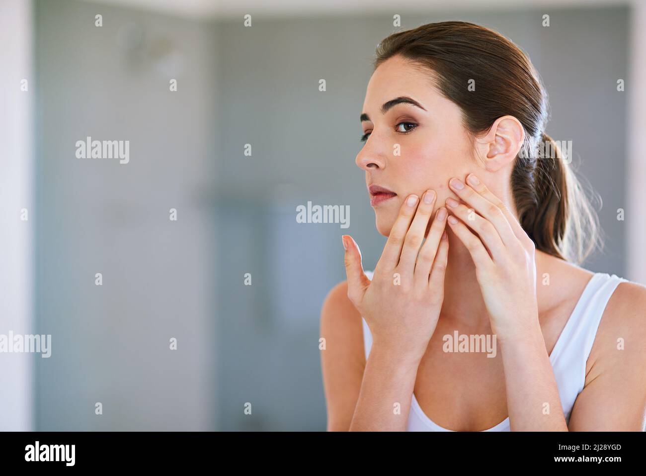 Woman squeezing spots hi-res stock photography and images - Alamy