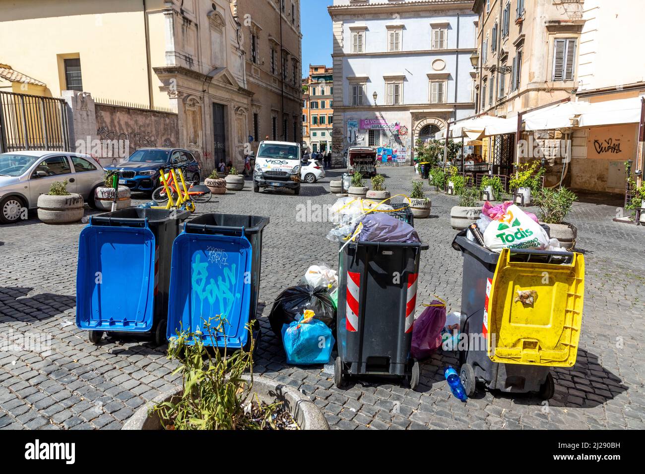 Rome, Italy - August 3, 2021: garbage cans separatet in yellow ...