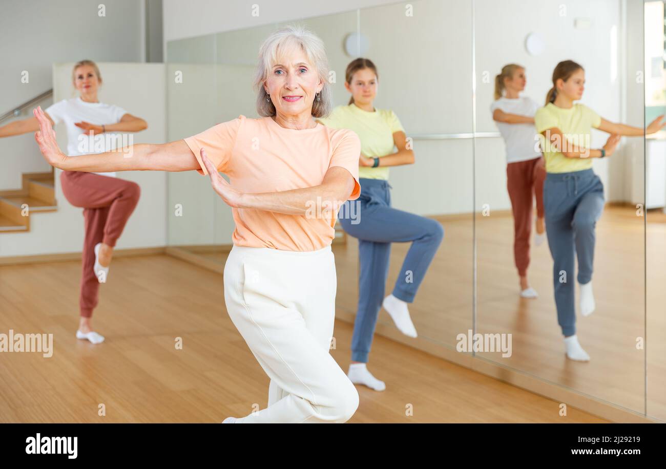 Aged lady dancing with her family in studio Stock Photo - Alamy
