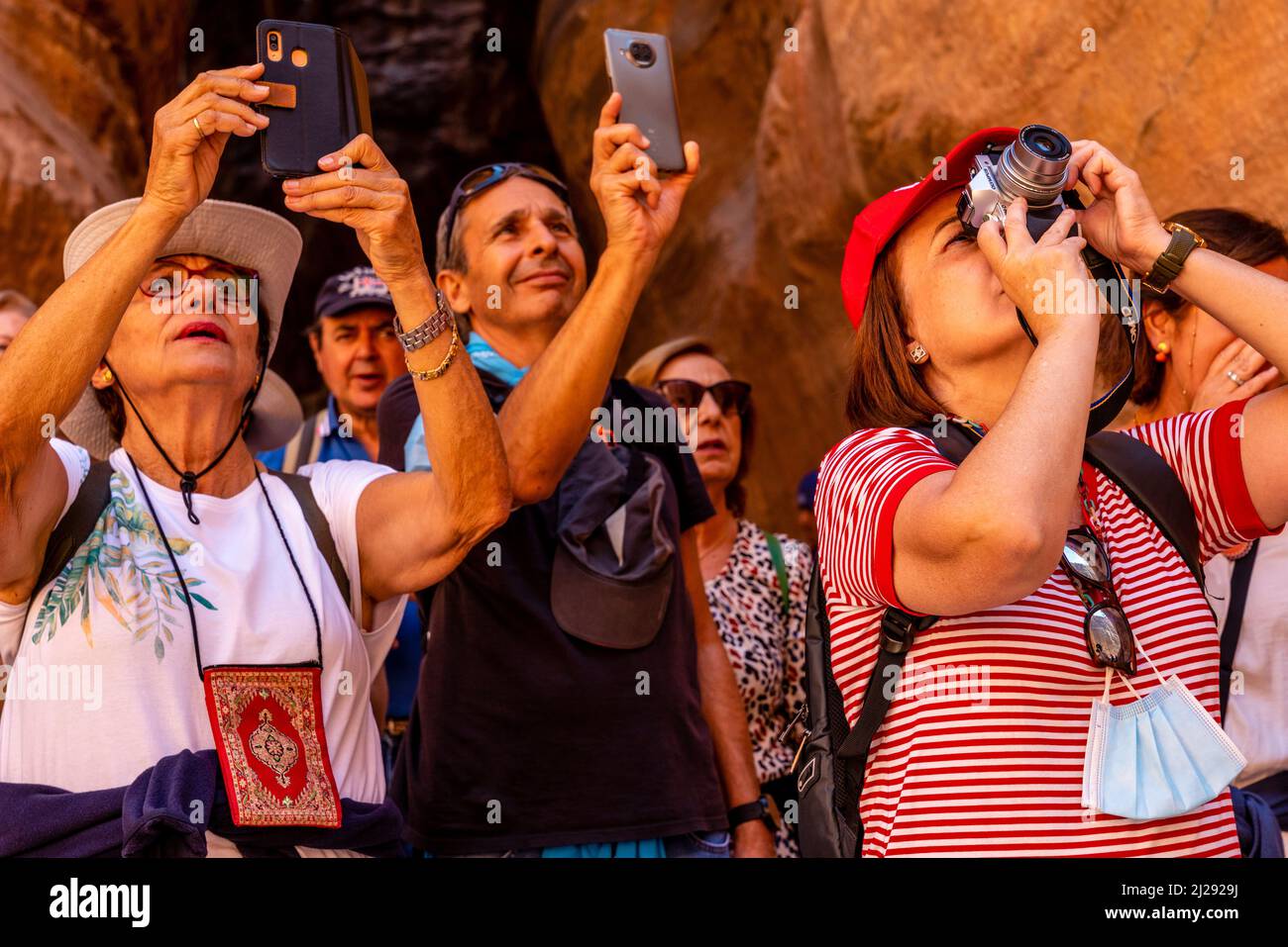 A Group Of Tourists Arrive At Petra and See The Iconic Facade Of The ...