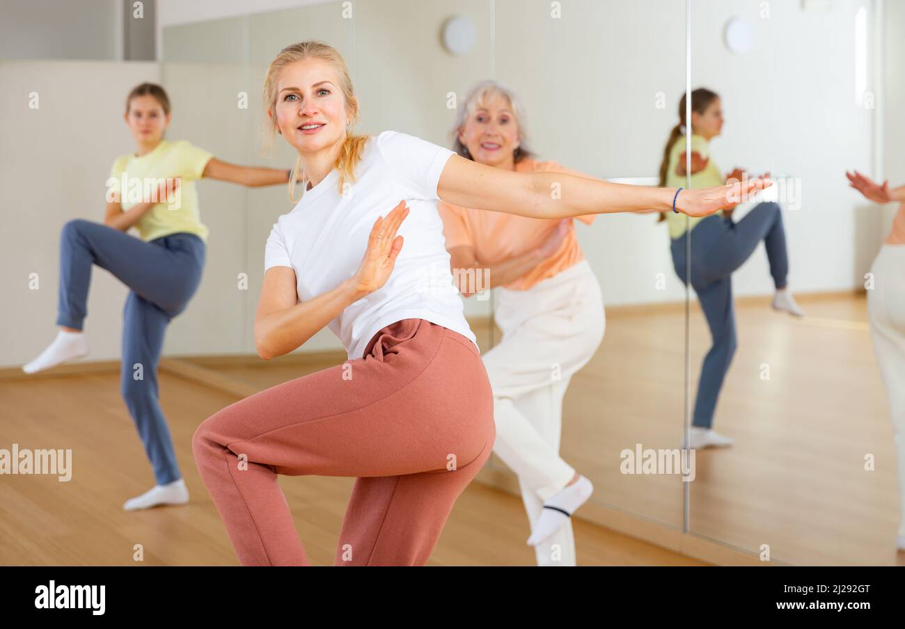 Women enjoying active dances in modern dance studio Stock Photo - Alamy