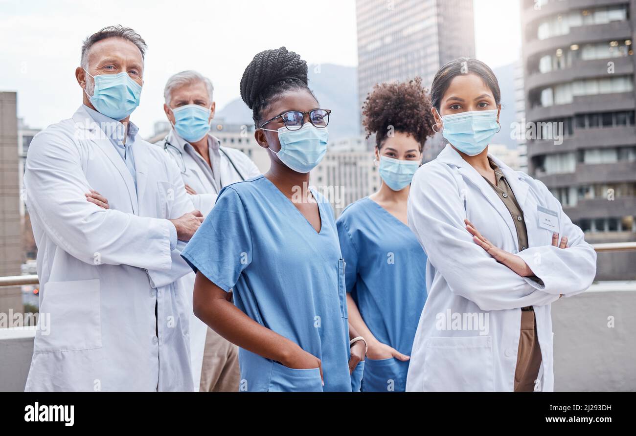 Theyre ready to tackle another day. Shot of a group of doctors standing ...