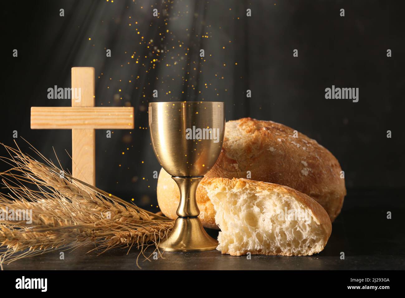 Chalice of wine with bread and cross on dark background. Holy Communion ...