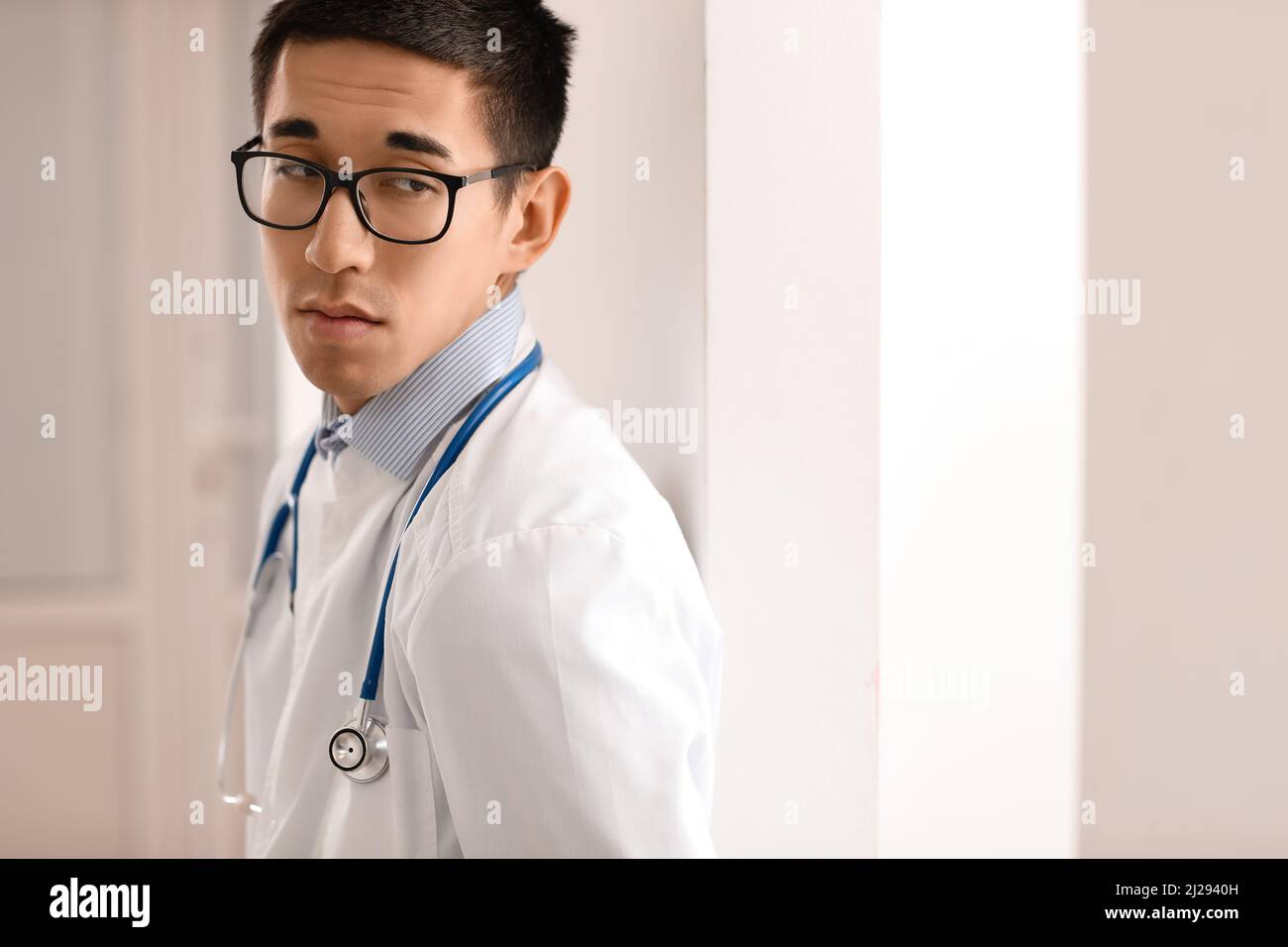Male Asian doctor worrying at hospital Stock Photo - Alamy