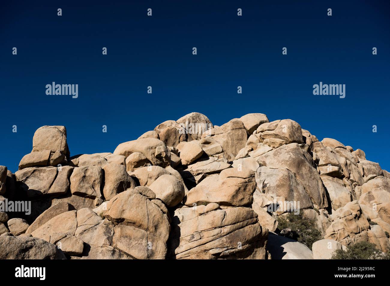 Smooth Rock Pile In Joshua Tree Below A Deep Blue Sky with no clouds ...
