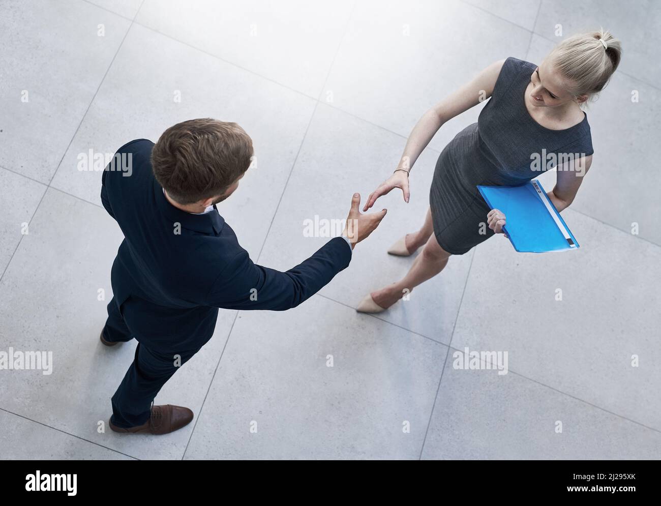 Merging skills to achieve success. High angle shot of two ...