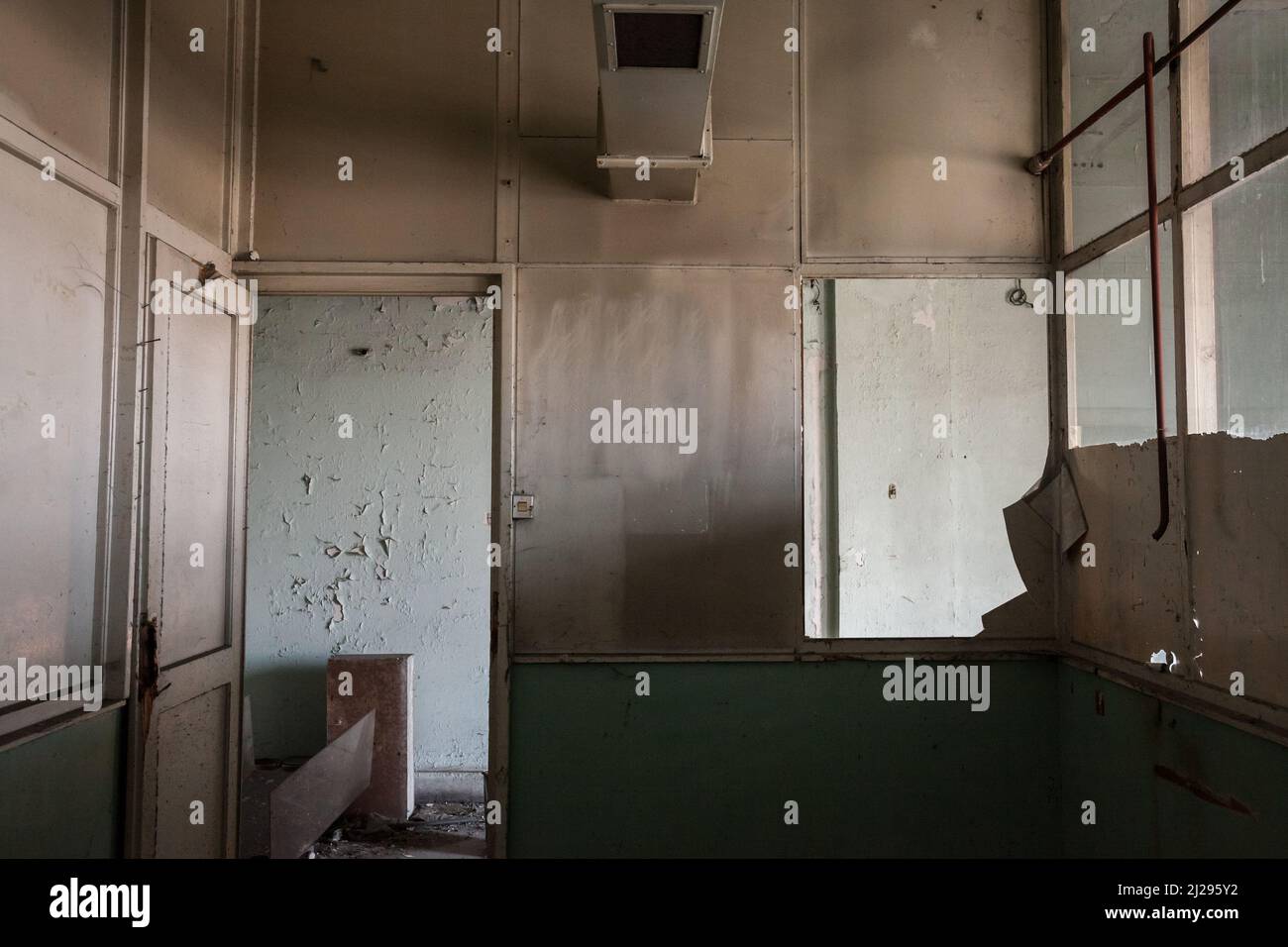 Picture of a damaged interior of an abandoned office building with a ...