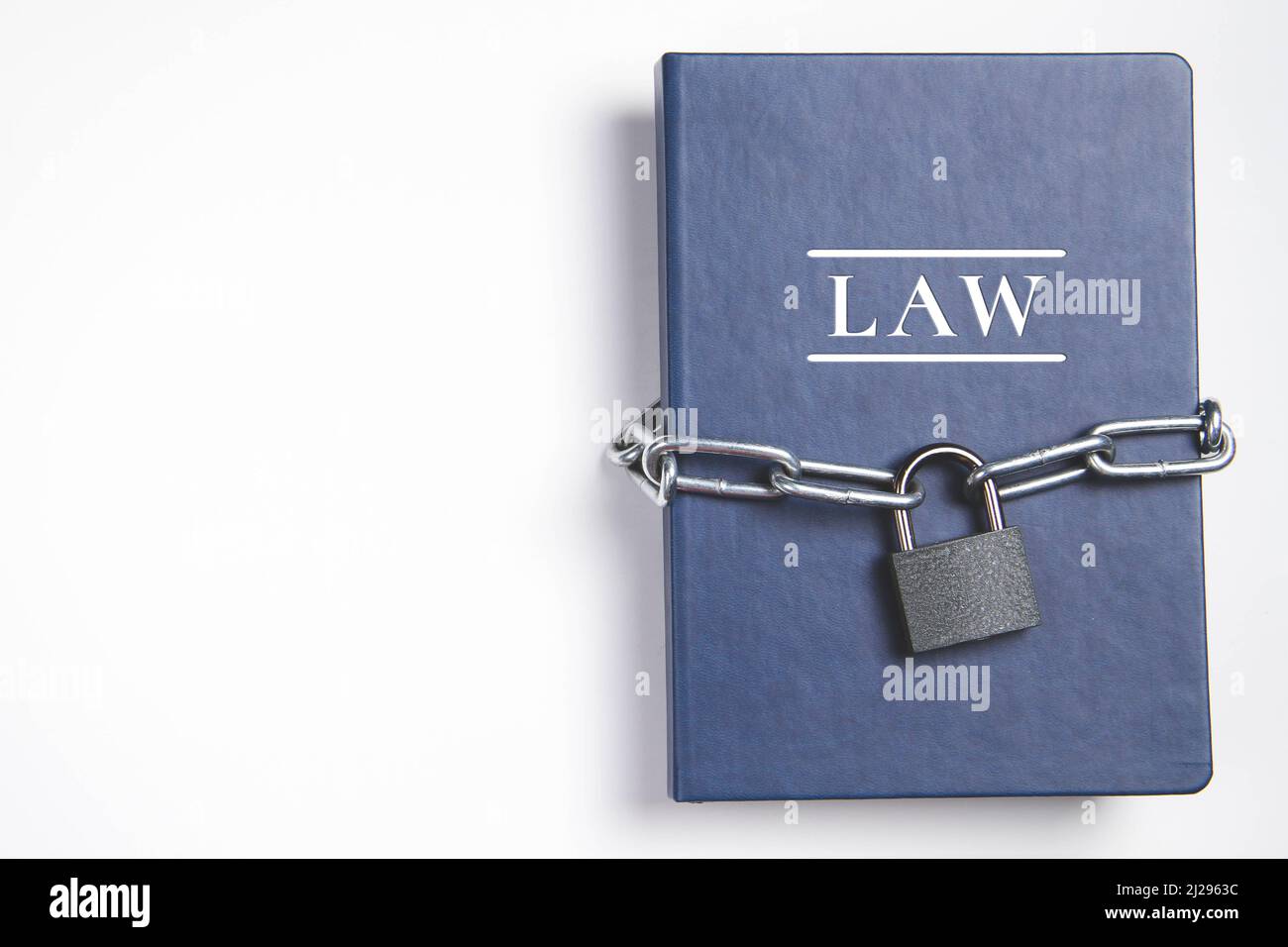 Law. Book with lock. A closed book is banned. The book was wrapped in a ...