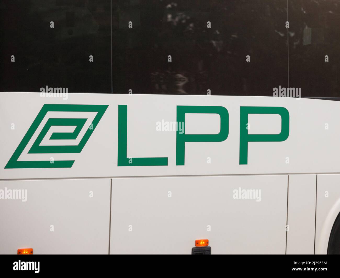 Picture of a LPP bus with its logo on a platform in Ljubljana bus ...