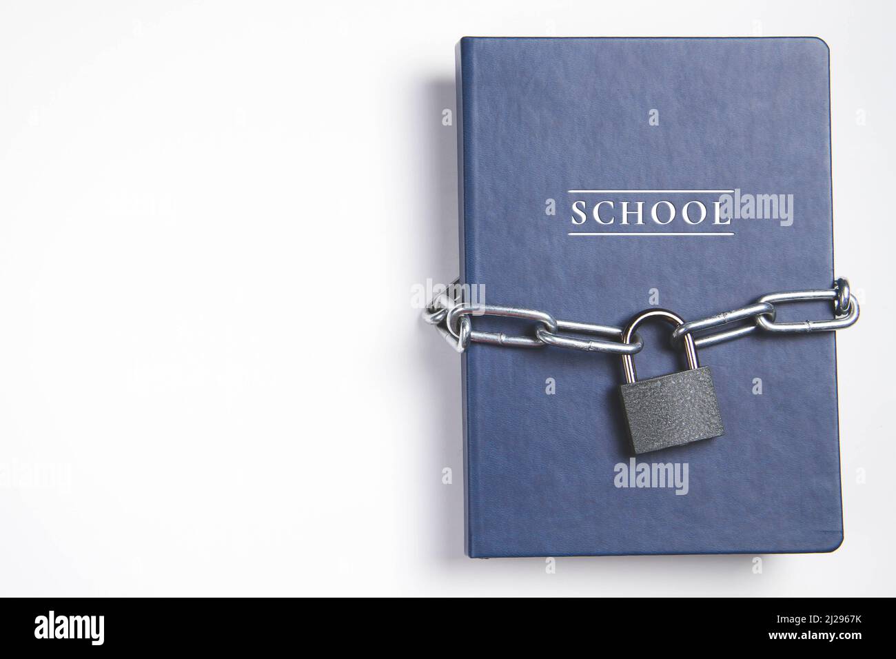 School. Book with lock. A closed book is banned. Chain on the book. On ...