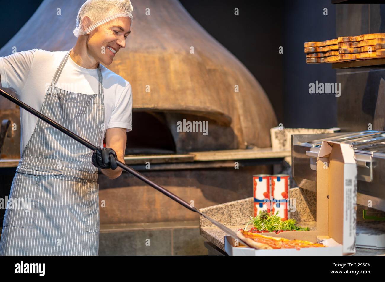 Chef preparing pizza in the bakery shop Stock Photo - Alamy