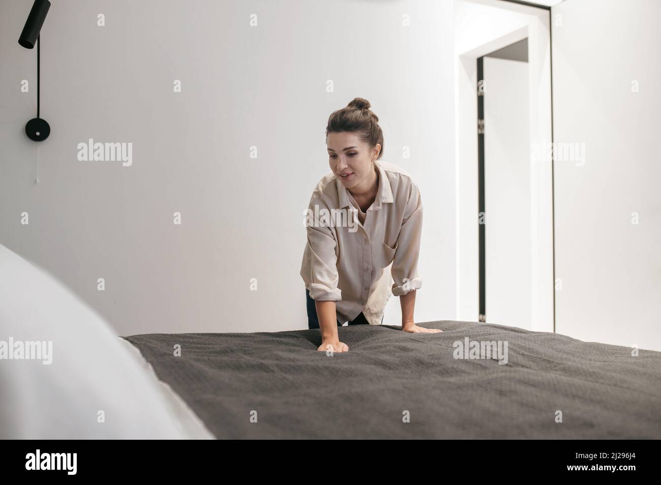 Household housewife making bed hi-res stock photography and images - Alamy