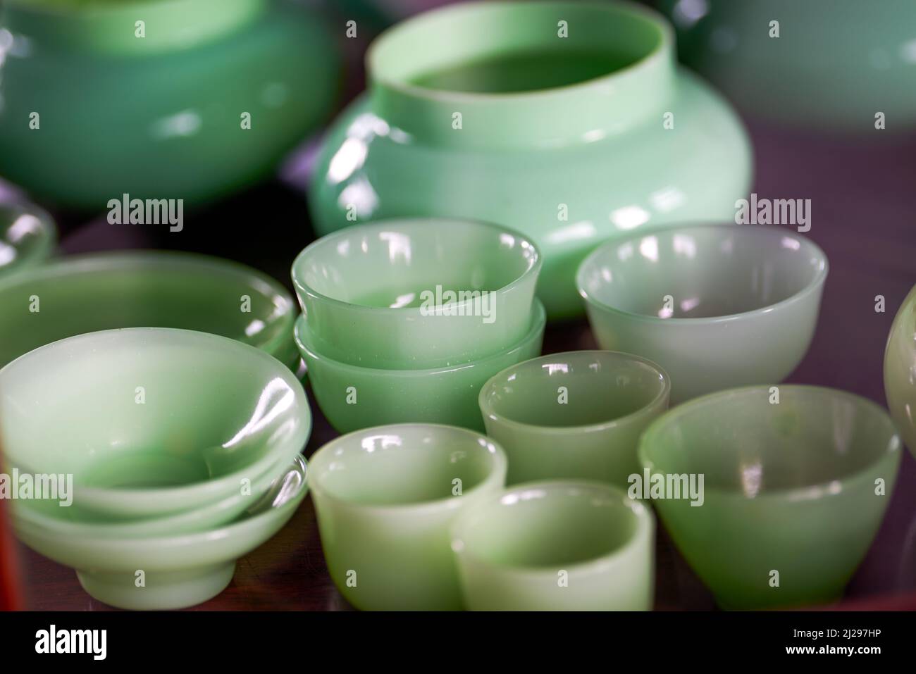 Pile of teacups and teapots made of jade jade Stock Photo - Alamy