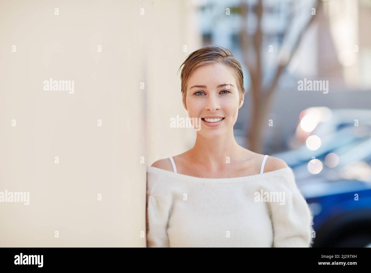 Today is going to be my day. Portrait of a smiling young woman standing ...