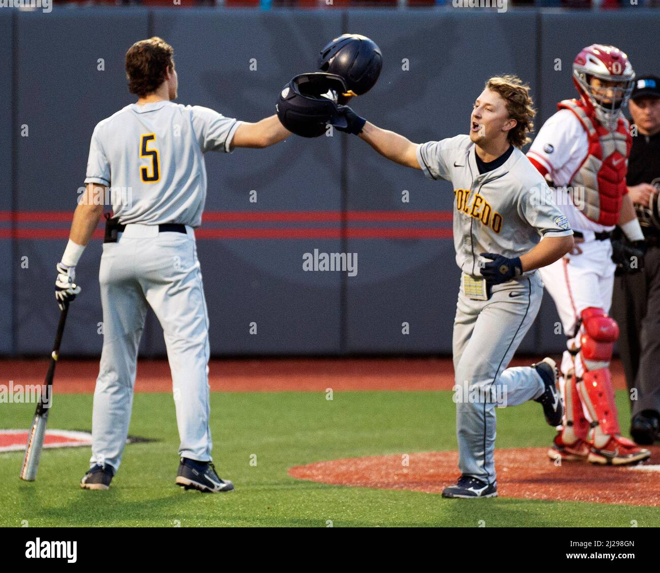 March 30, 2022:Toledo Rockets outfielder Caden Konczak (right ...