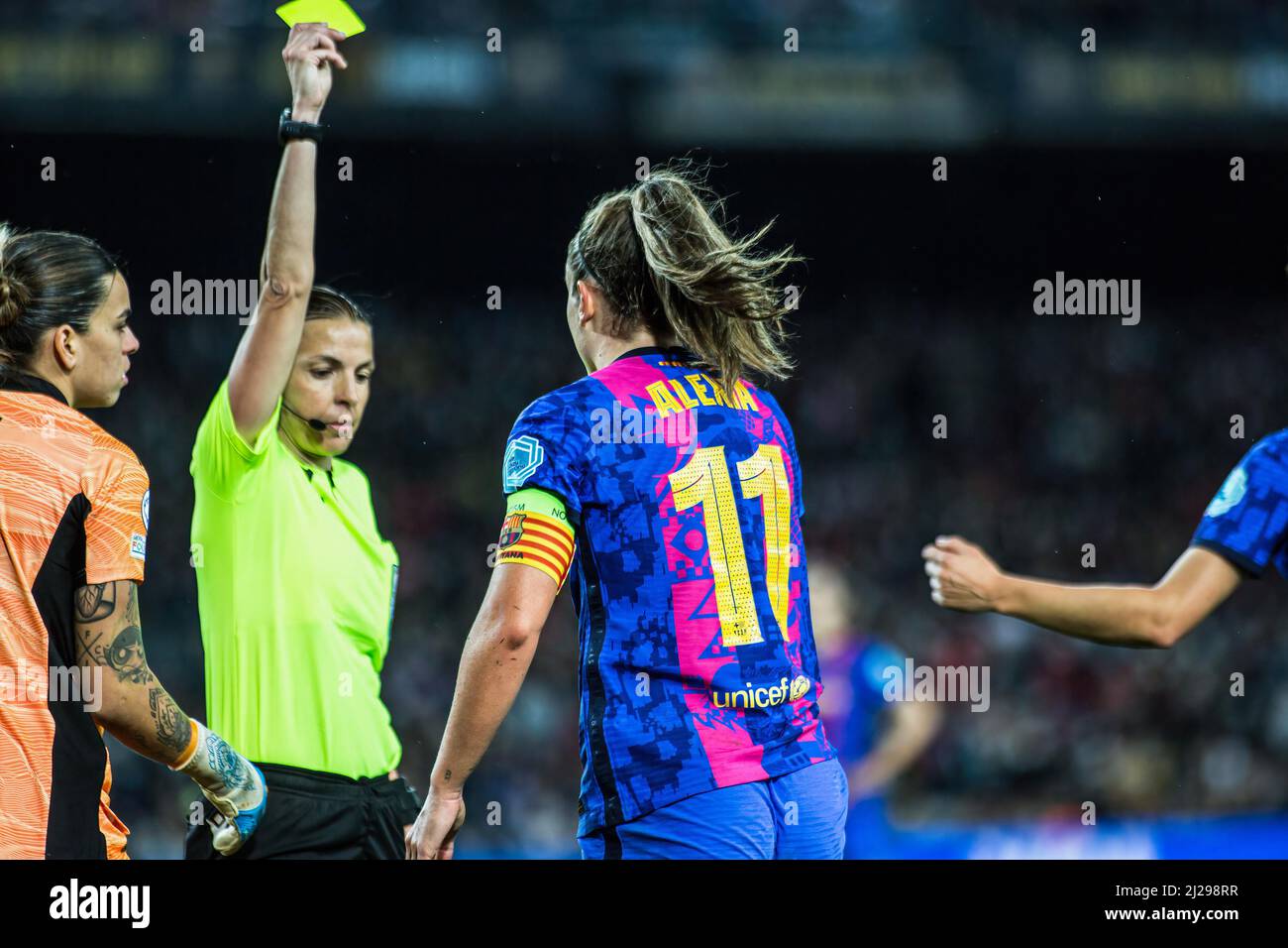 Alexia Putellas (C) of FC Barcelona receive a yellow card from the ...