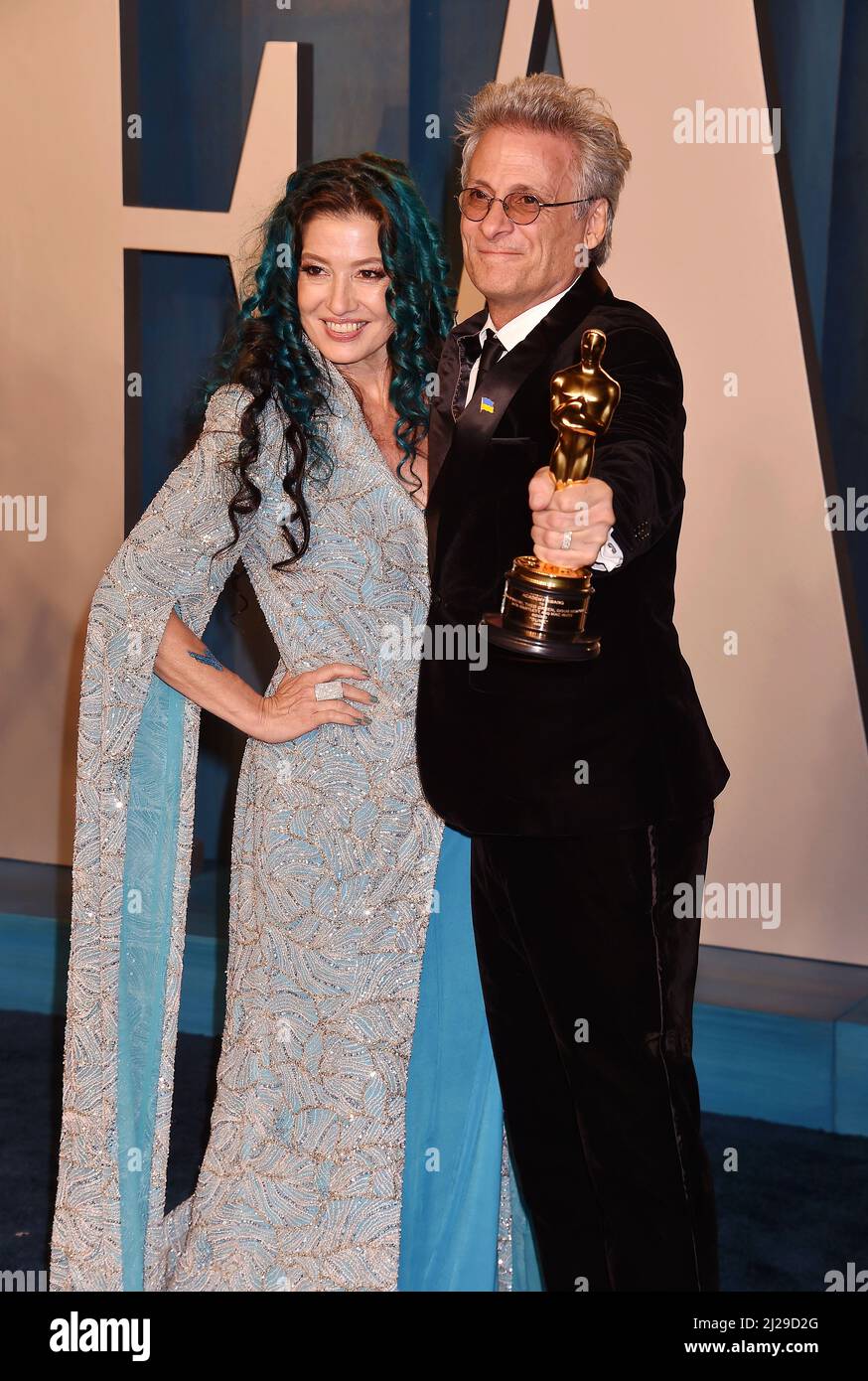BEVERLY HILLS, CA - MARCH 28: (L-R) Ann Mangini and Mark Mangini attend ...