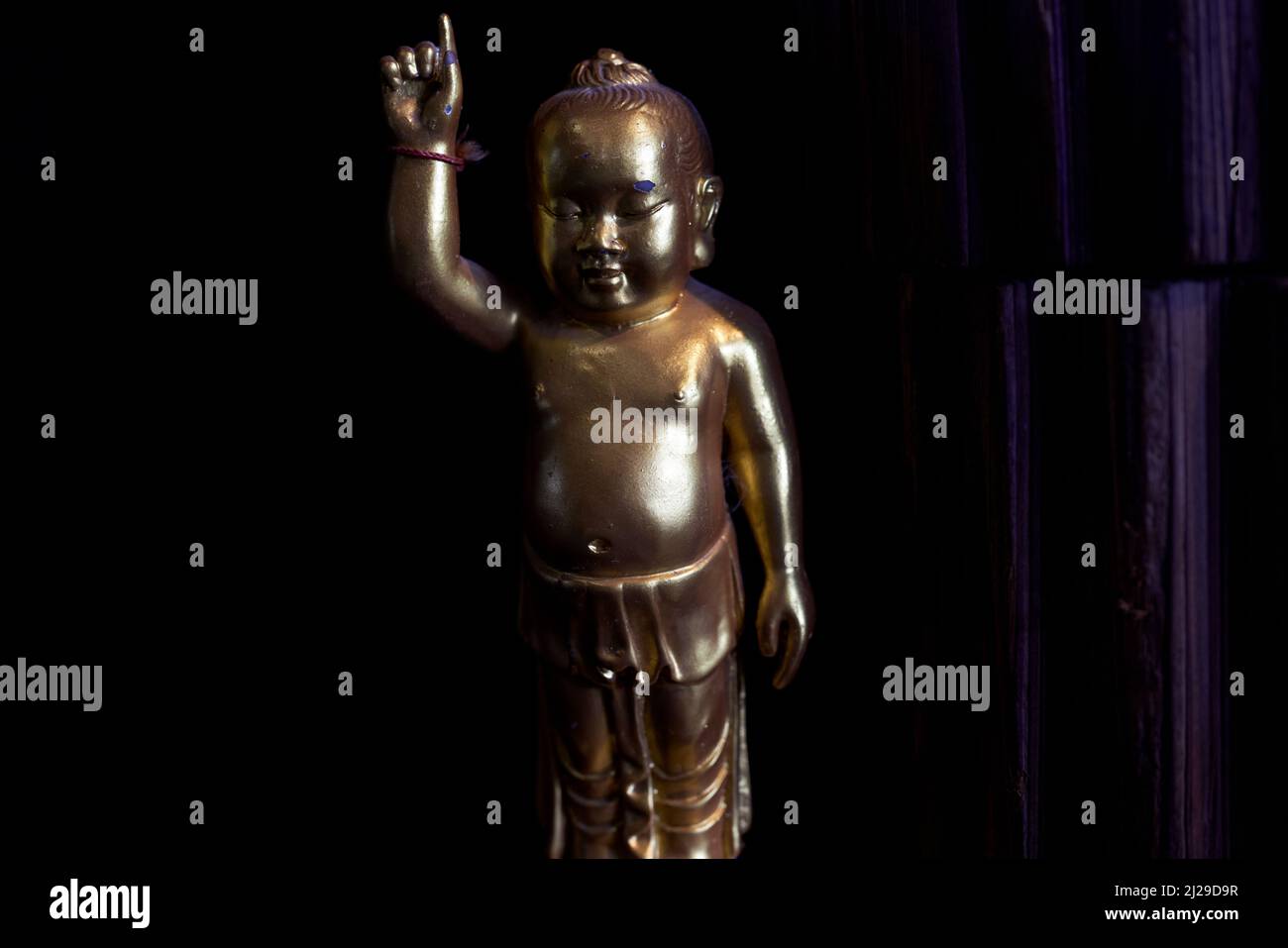A small metal monk ornament ornament Stock Photo - Alamy