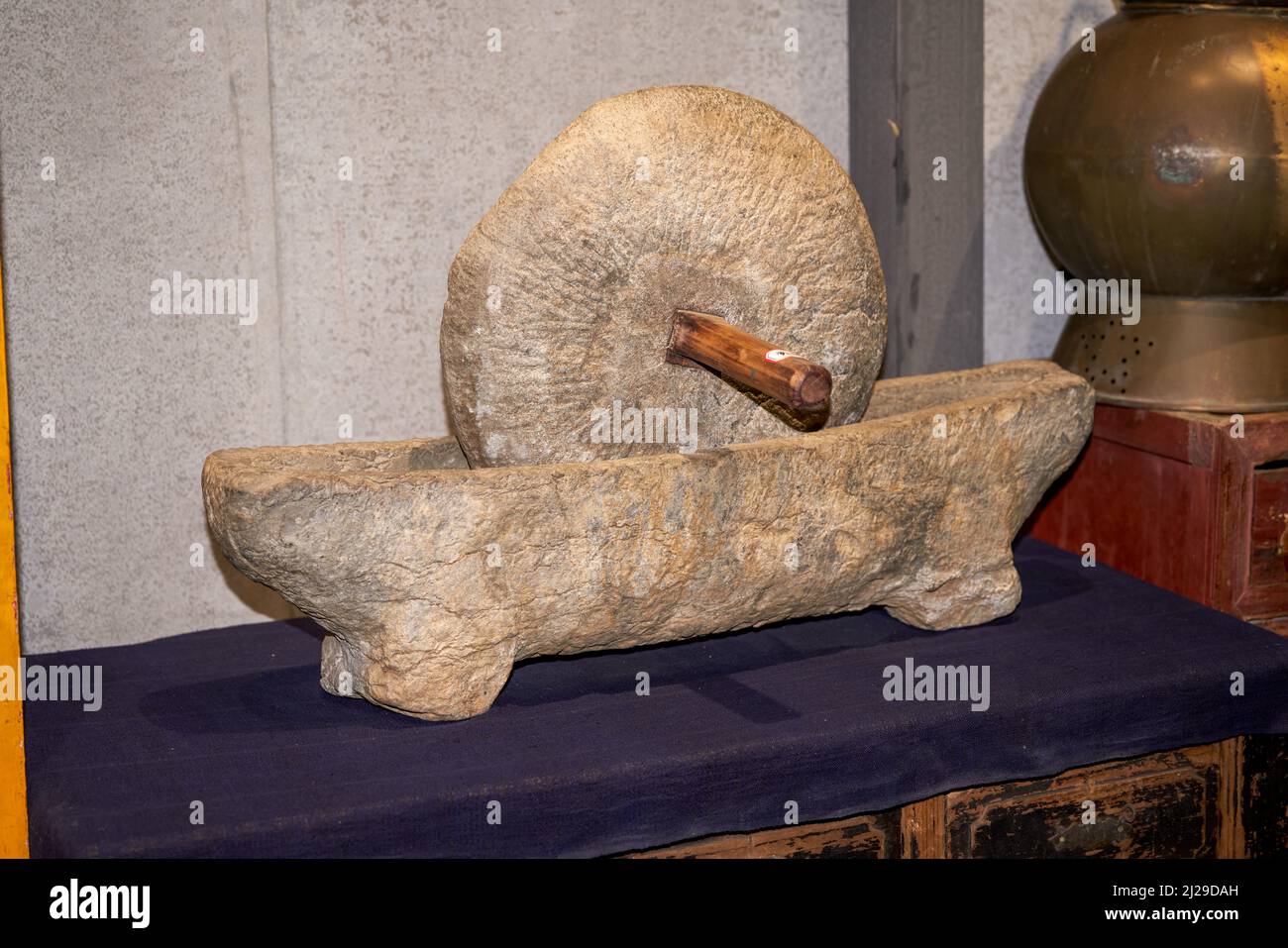Large grinding stone grinding disc used in rural China Stock Photo - Alamy