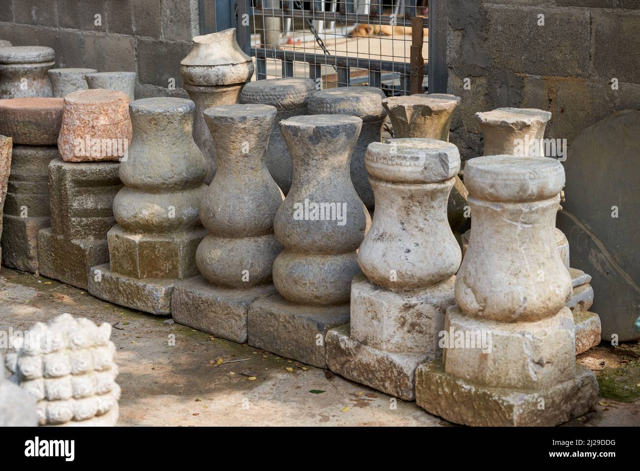 A close-up of a pile of stone pillars in a stone carving factory Stock ...