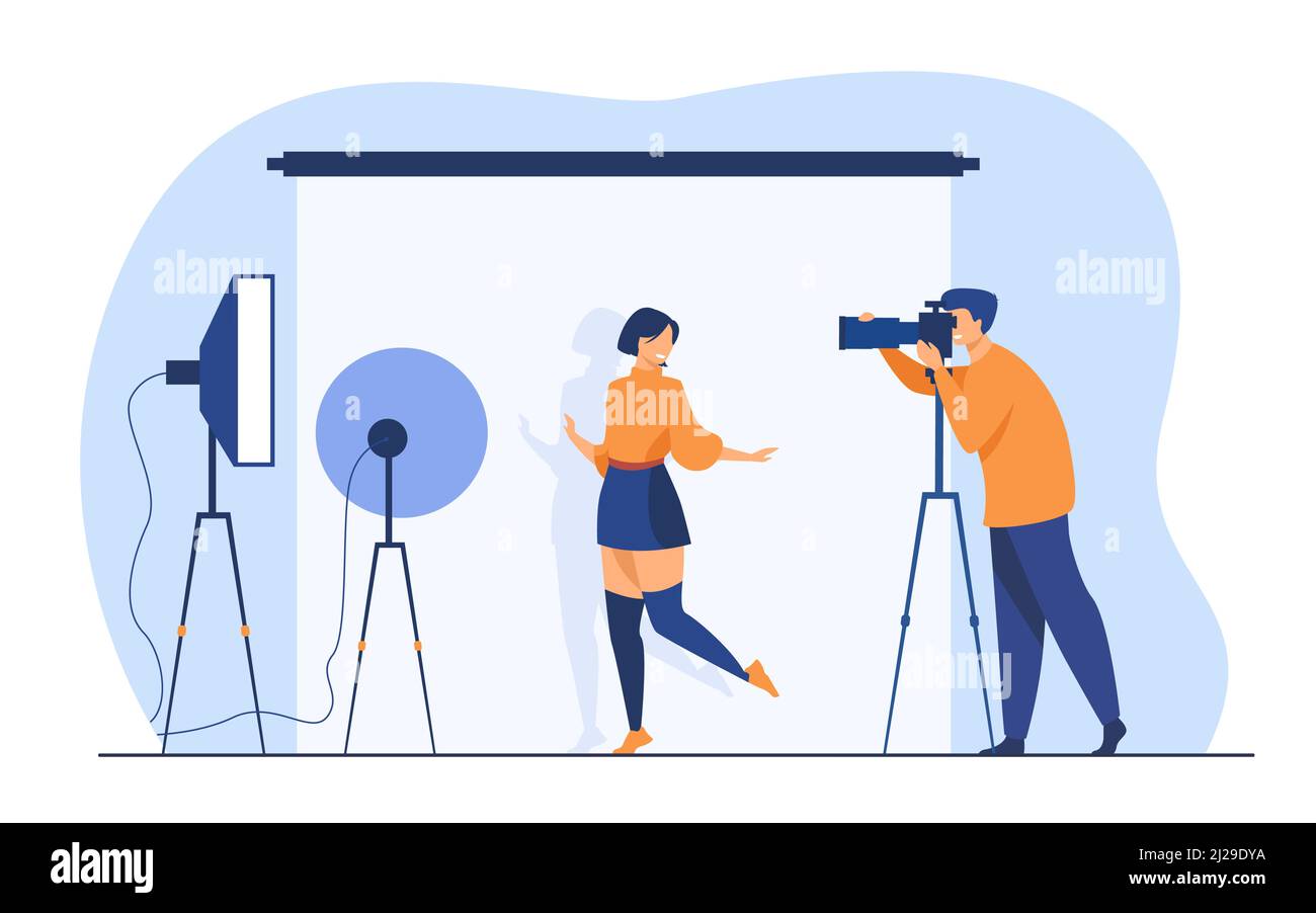 Professional photographer taking pictures of young woman. Female model ...