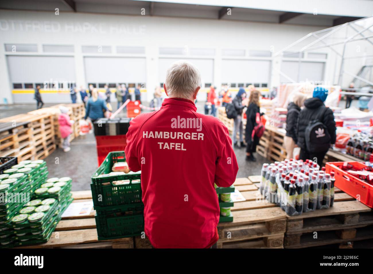 Hamburg, Germany. 30th Mar, 2022. A man wears a jacket with the ...