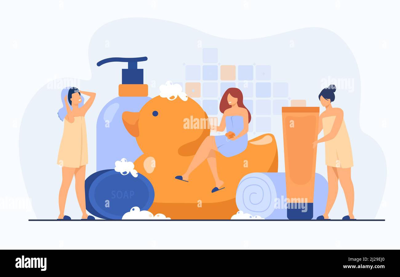 Women wrapped in towels using sponge and soap among bath accessories ...