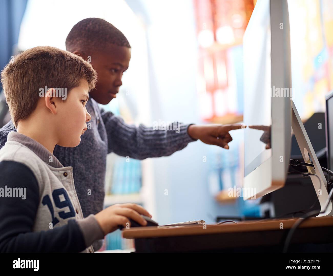 Make technology a fun part of their learning experience. Shot of ...