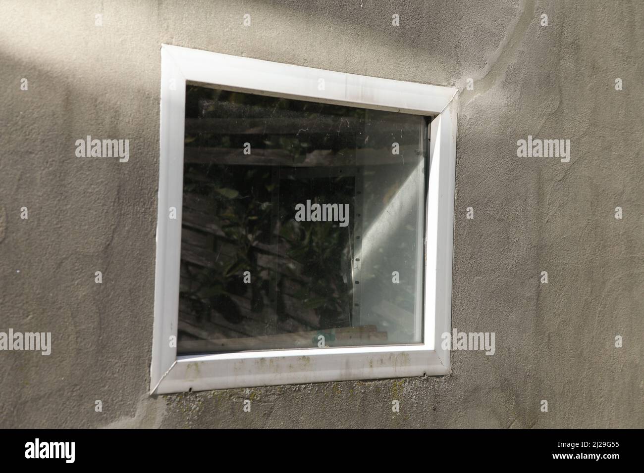An old window with a dirty glass Stock Photo - Alamy