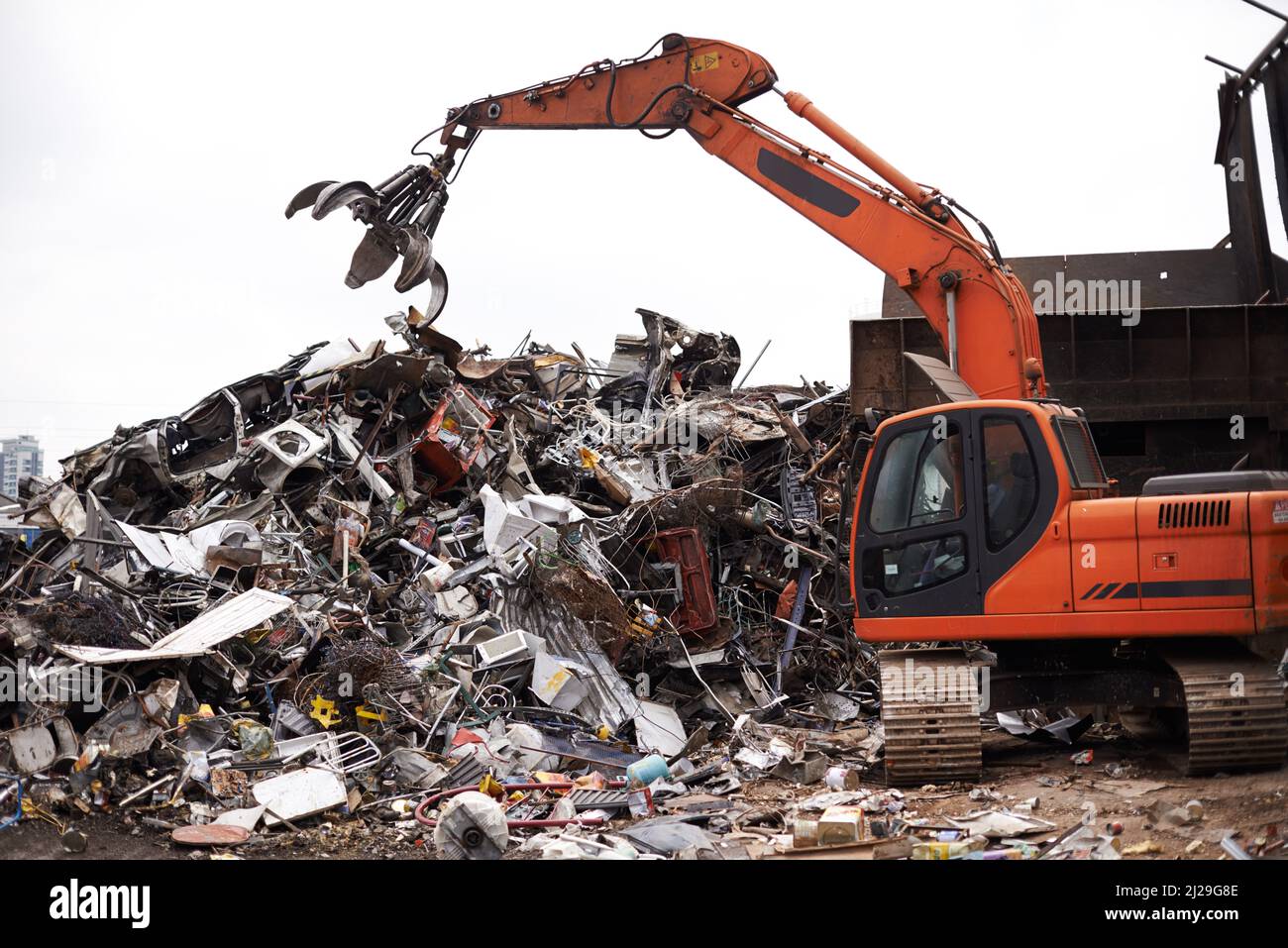 Processing industrial trash. Cropped shot of a crane at work in a ...