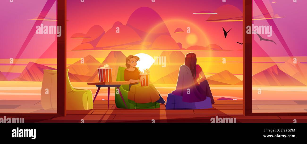 Woman rest on house terrace with view to lake and mountains at sunset ...