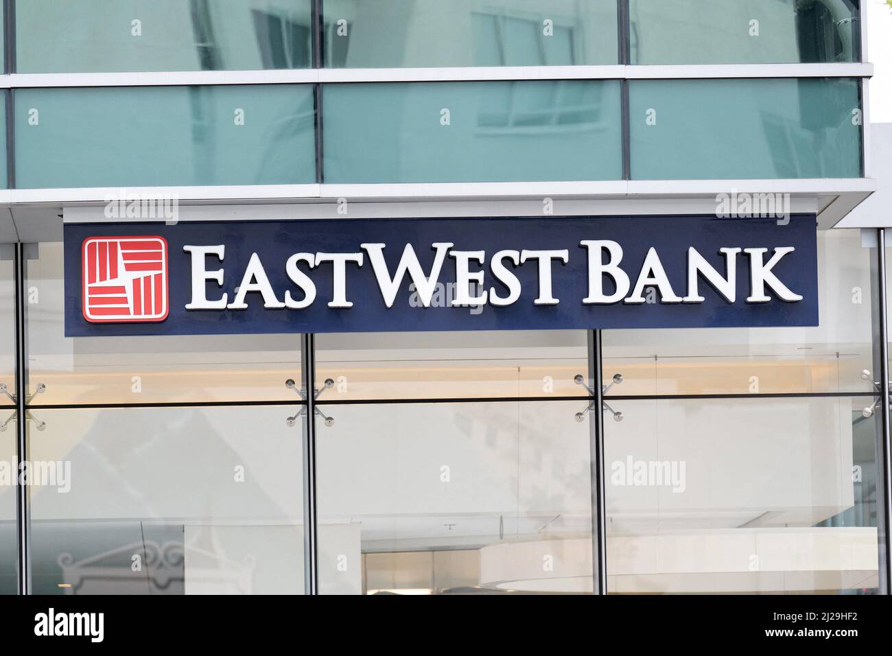 A shop sign of EAST WEST BANK, on March 28 2022 in Los Angeles CA, USA ...