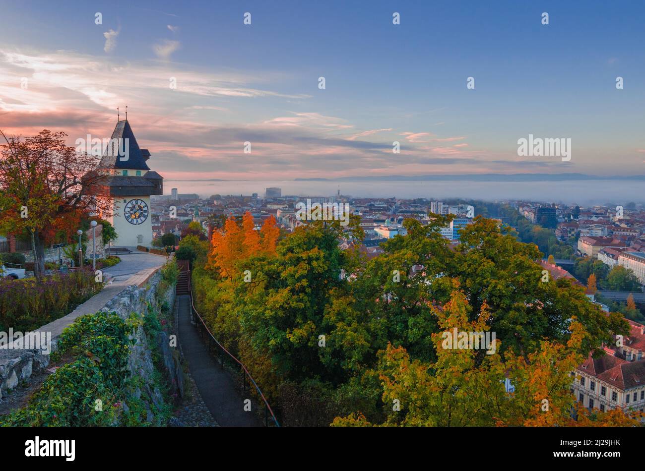 Cityscape of Graz and the famous clock tower (Grazer Uhrturm) on ...
