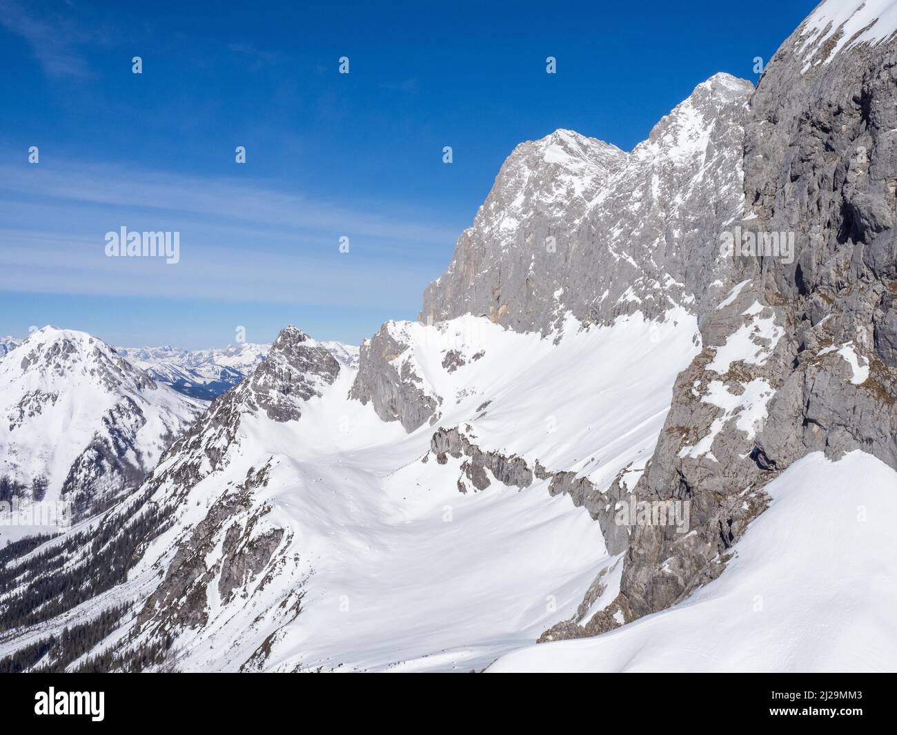 Blue sky over winter landscape, mountain peak of the Dachstein massif ...
