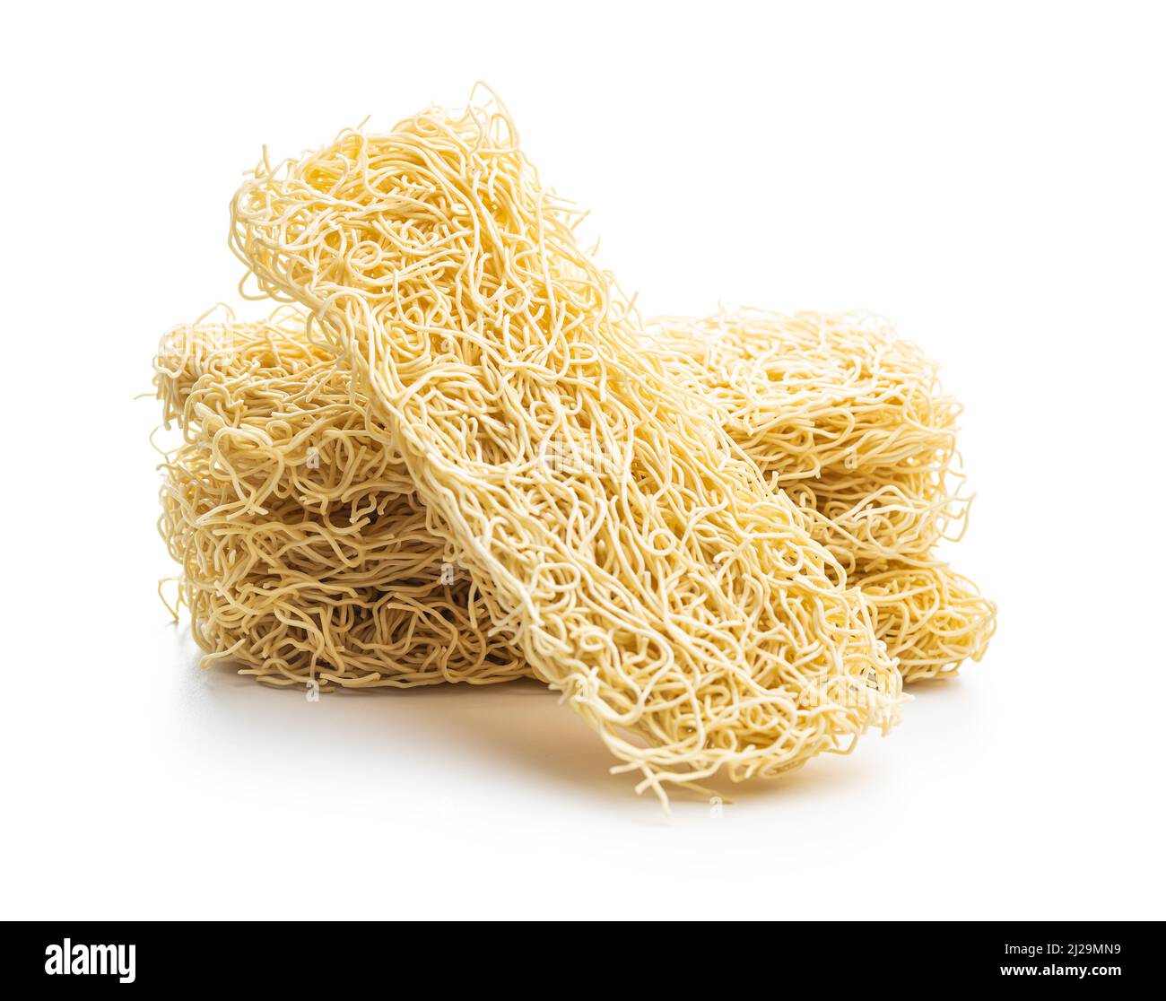 Instant noodles. Uncooked chinese noodles isolated on a white ...