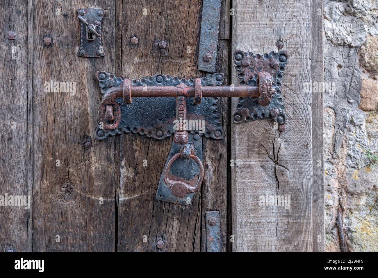 Iron forged padlock with lock, old castle gate of the medieval Herzberg ...