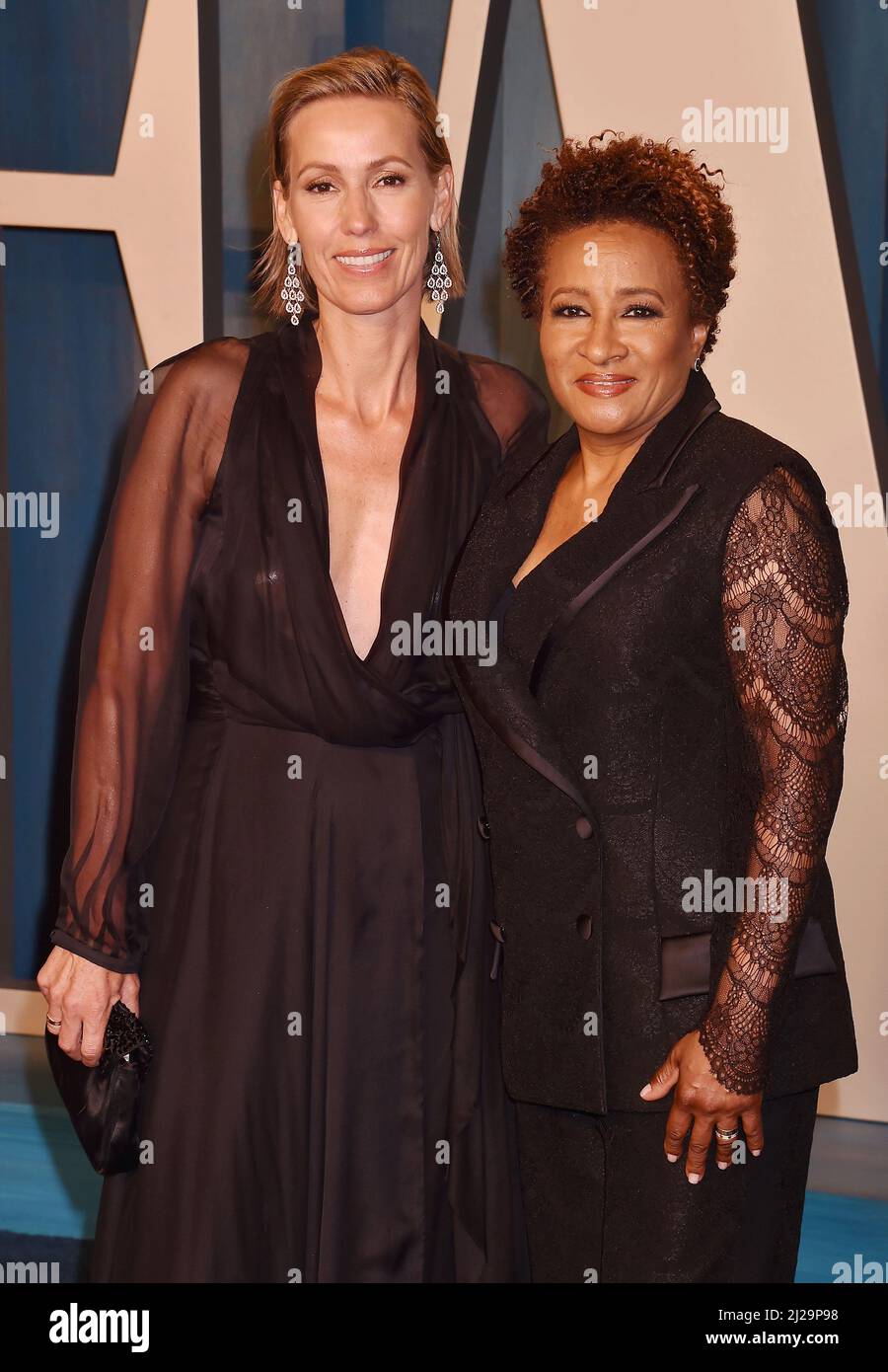 BEVERLY HILLS, CA - MARCH 27: (L-R) Alex Sykes and Wanda Sykes attend ...