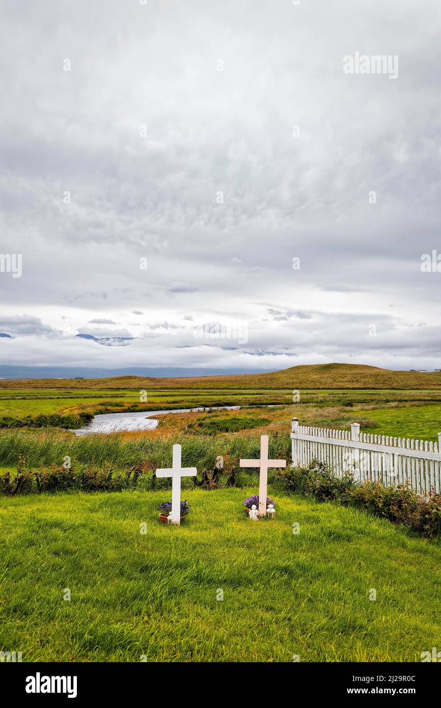 Cemetery, two graves next to each other, white wooden crosses in a ...