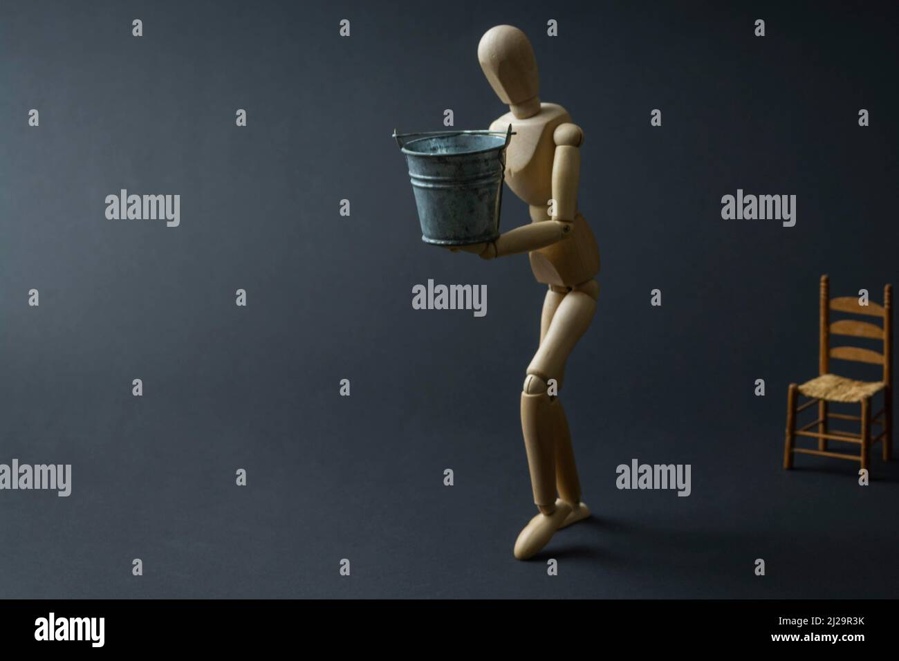 The mannequin is carrying a bucket Stock Photo - Alamy