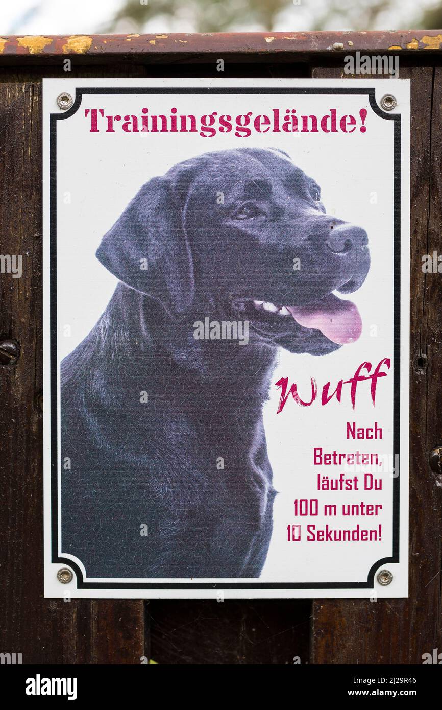 Warning sign in front of dog with notice Training ground, Meissen ...