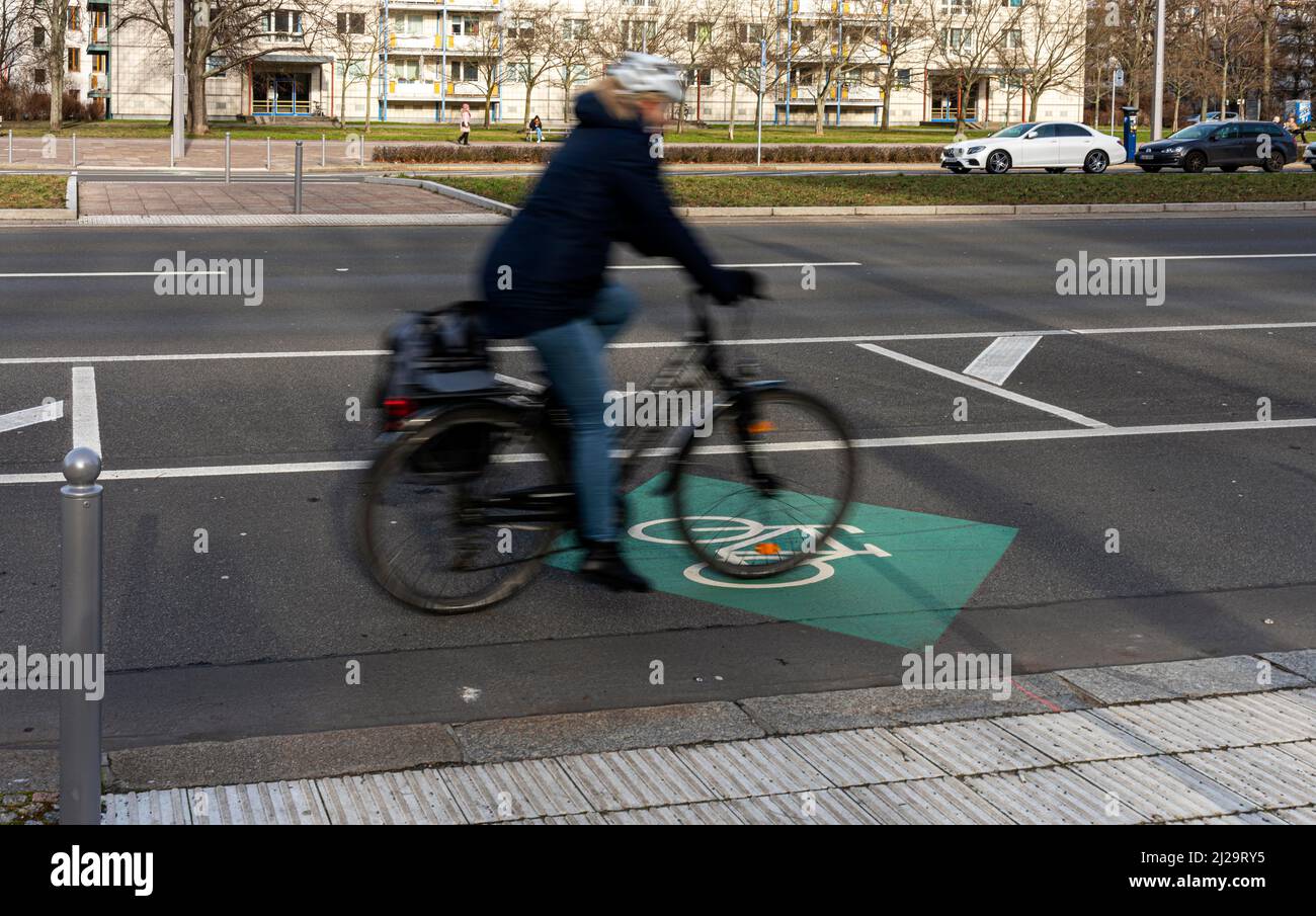 Cyclists on the wide cycle path in Karl-Marx-Allee, Berlin, Germany ...