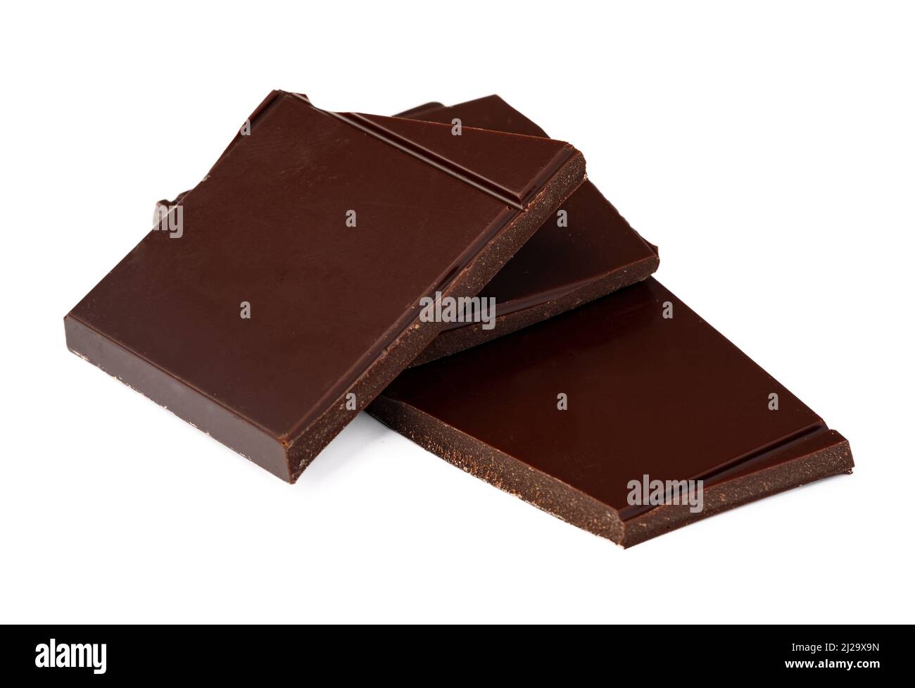 Small dark chocolate pieces isolated on white background Stock Photo ...