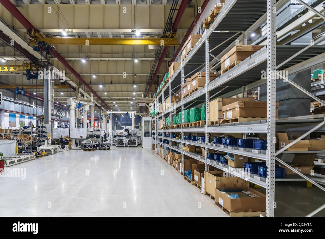 Modern distribution retail warehouse interior with many high shelves ...