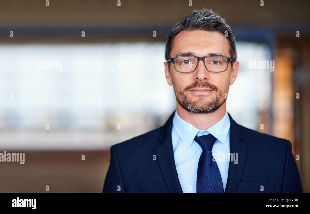 Im big on business. Portrait of a confident businessman in an office ...